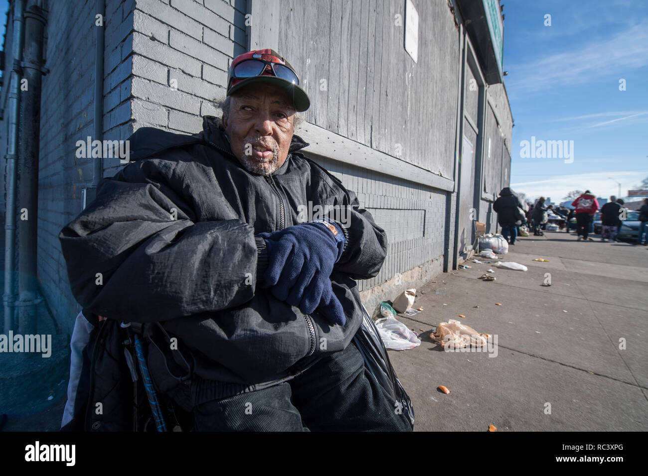 Detroit, USA. 13th Jan, 2019. A man in a wheelchair sits in front of a ...