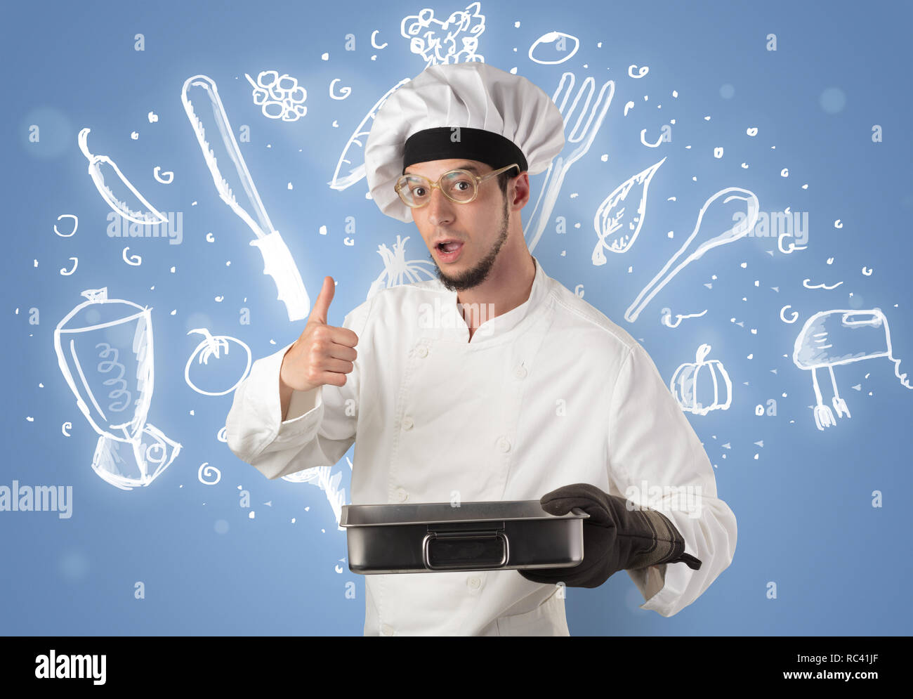 Young cook with kitchen instruments and drawn recipe concept on ...