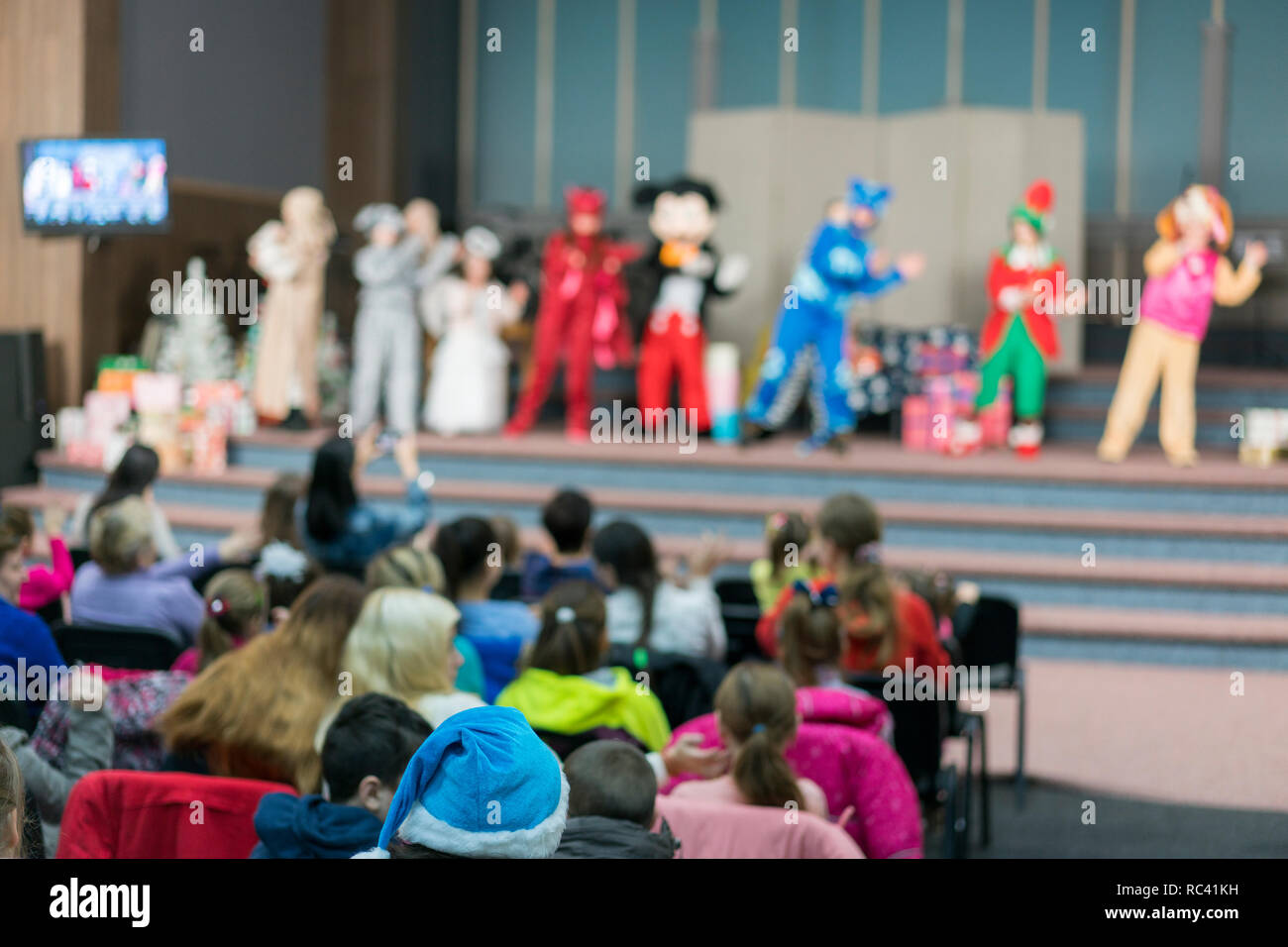Performance for children on stage. Children on stage perform in front ...