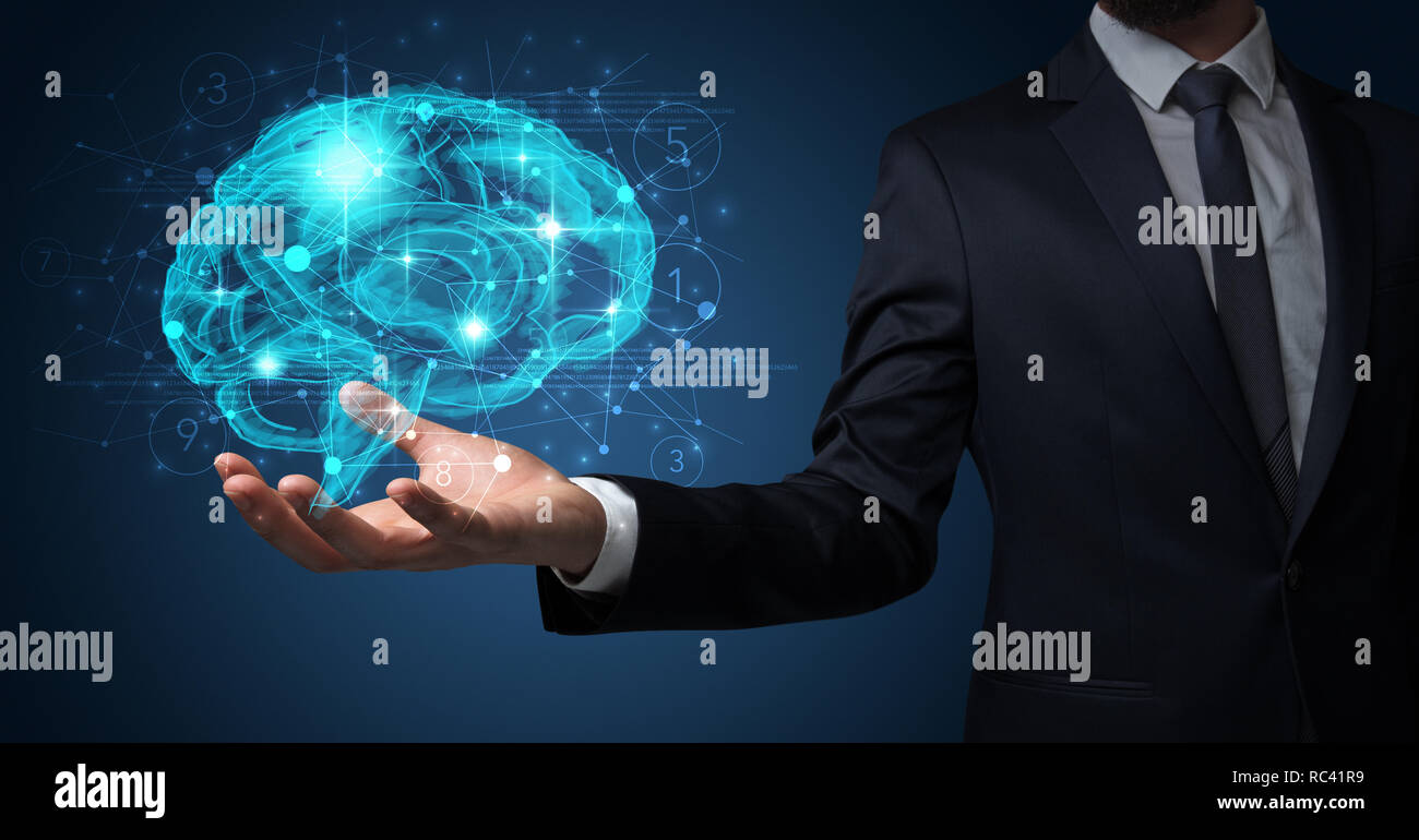 Businessman holding human brain on his hand with logistics symbols ...