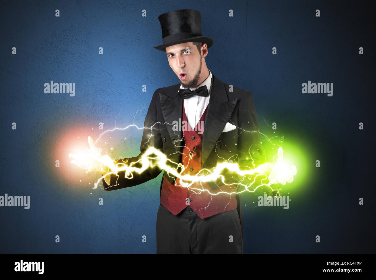 Magician sparkling super power between his two hands Stock Photo - Alamy