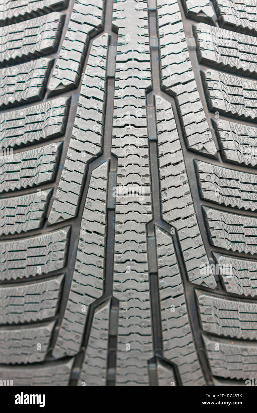 Close-up winter tire tread. Textured tire tread. Part of brand new ...