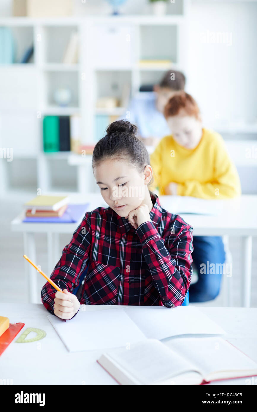 Girl in classroom Stock Photo - Alamy