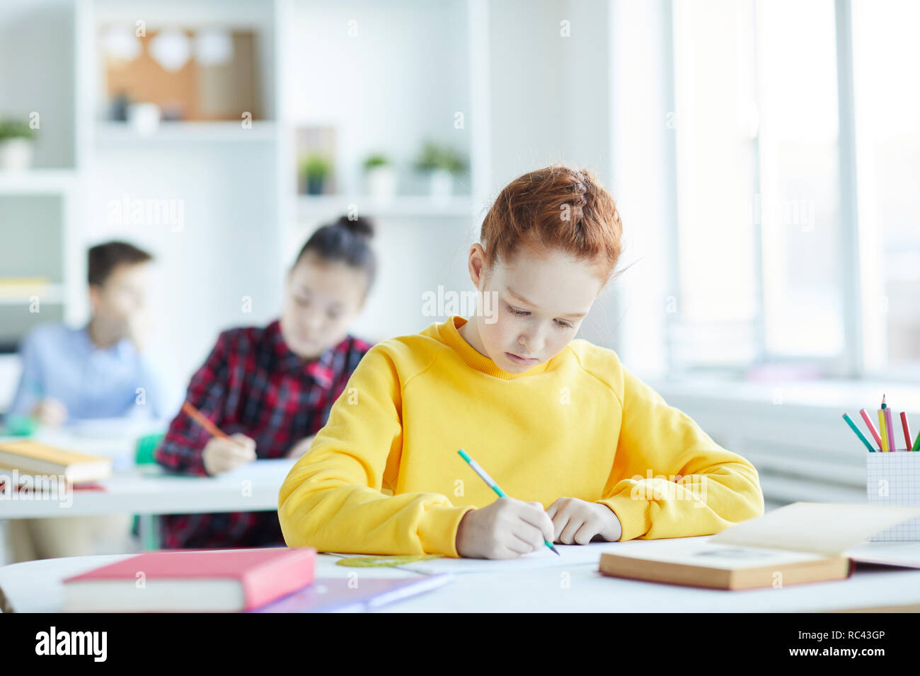 Making notes at lesson Stock Photo - Alamy