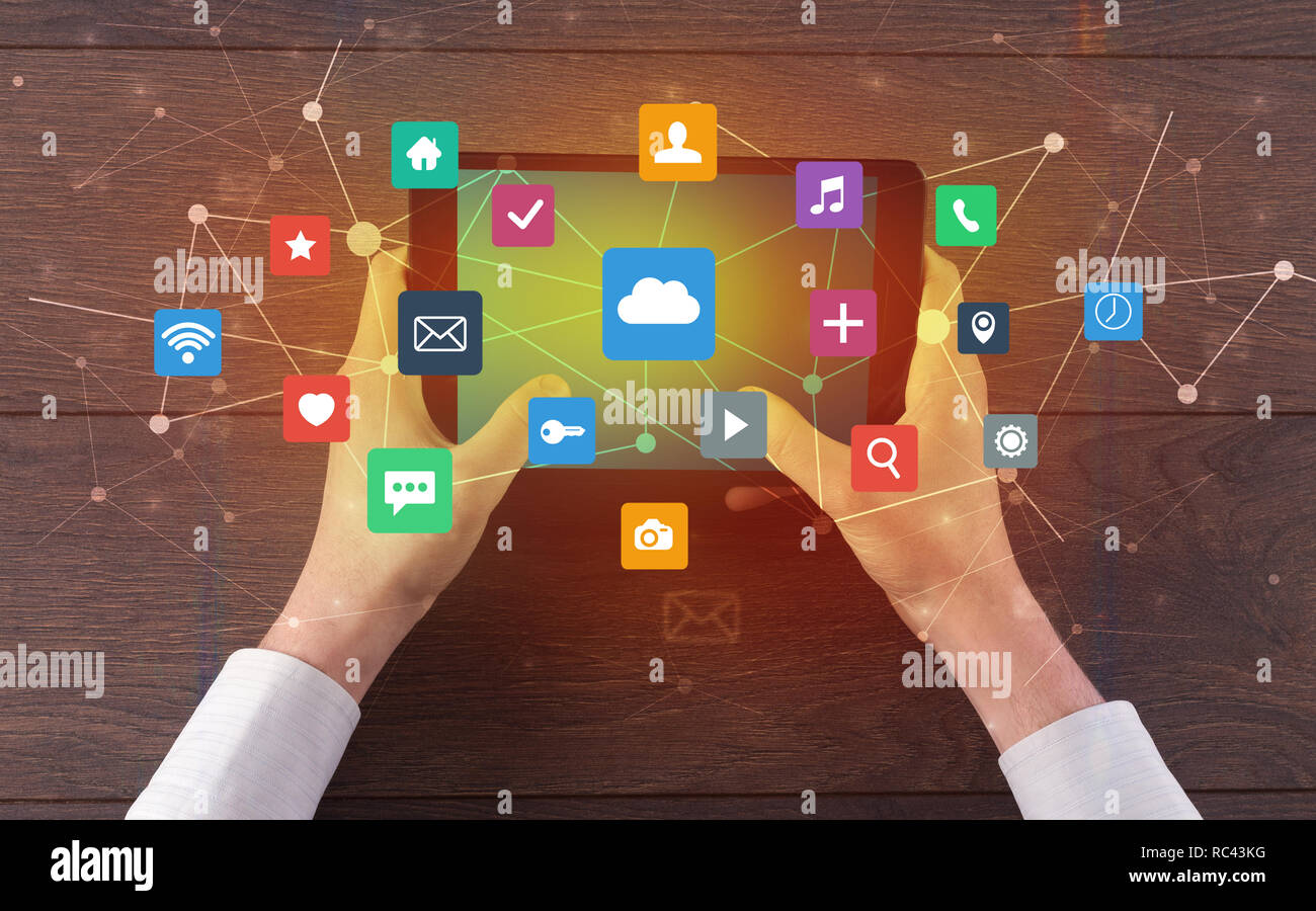 Hand touching multitask tablet with cloud wifi message social media ...