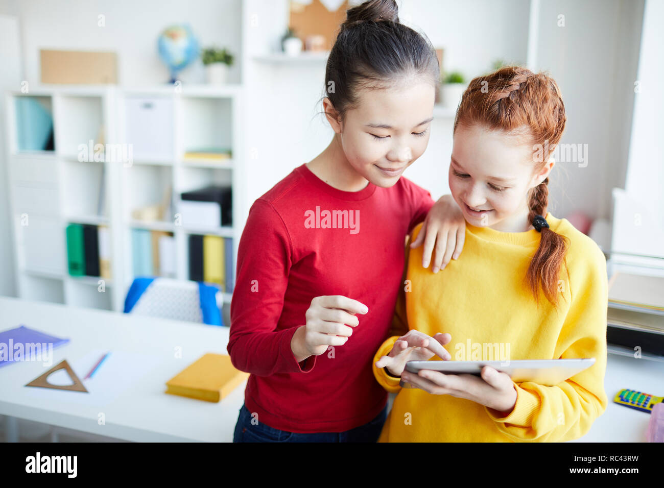 Browsing after lesson Stock Photo - Alamy