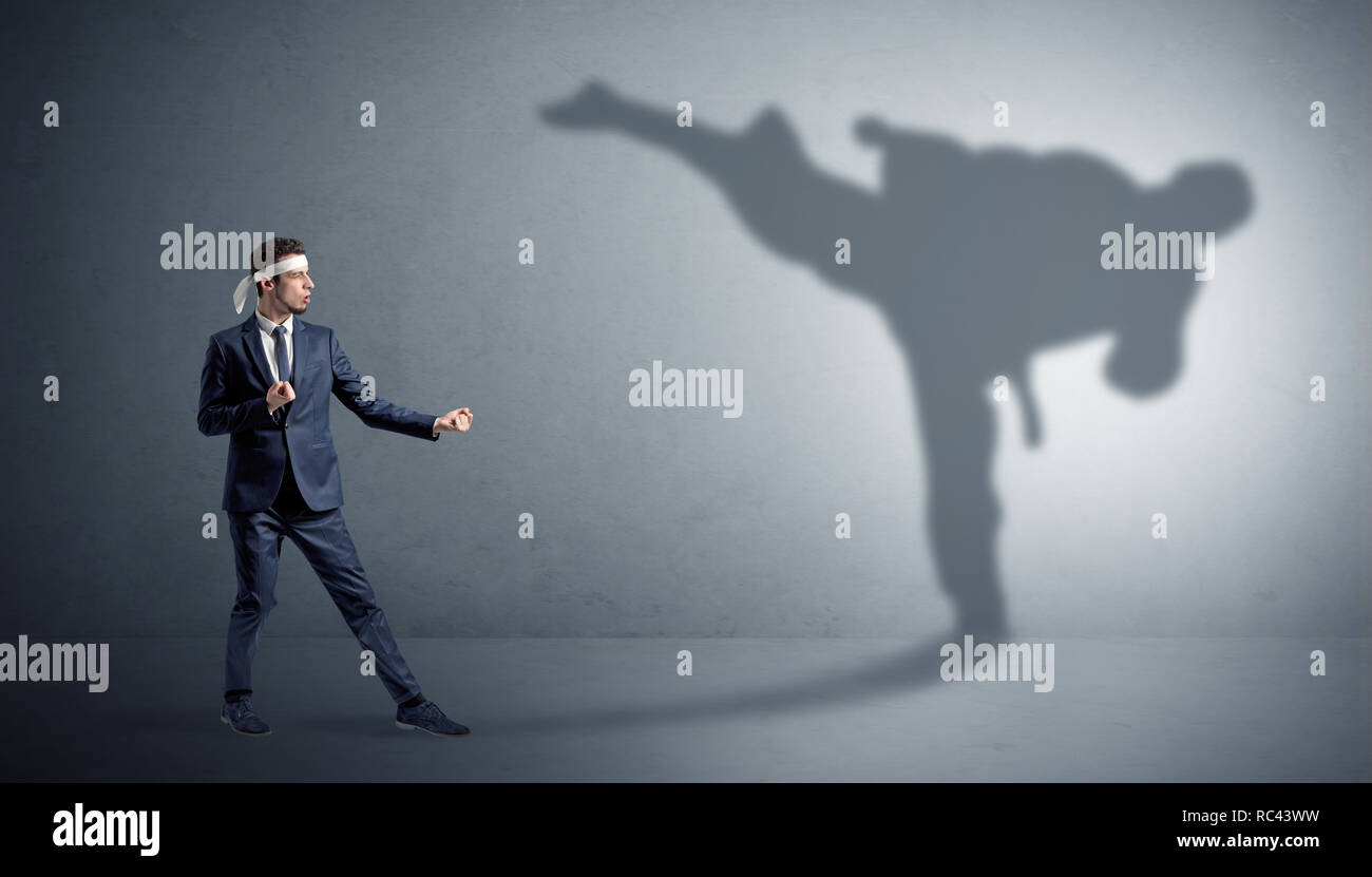 Young karate man confronting with his own shadow Stock Photo - Alamy