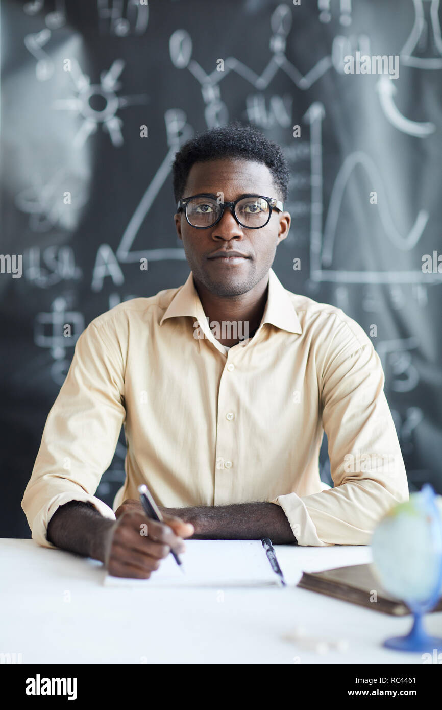 Teacher by workplace Stock Photo - Alamy