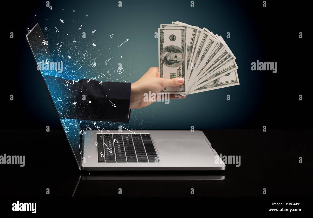 Money coming out of laptop hi-res stock photography and images - Alamy