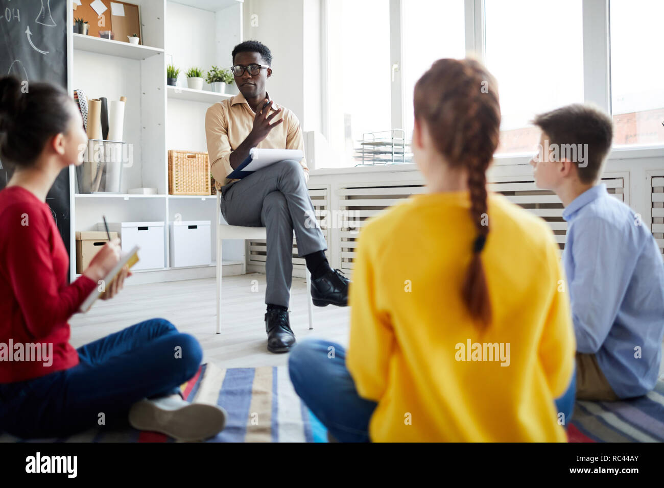 Talking to learners Stock Photo - Alamy