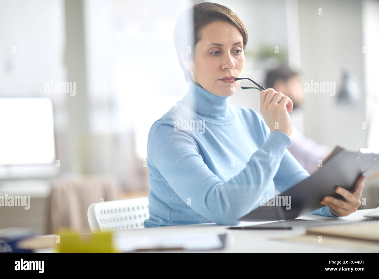 Businesswoman working documents reading contract hi-res stock ... Businesswoman working documents reading contract hi-res stock ...
