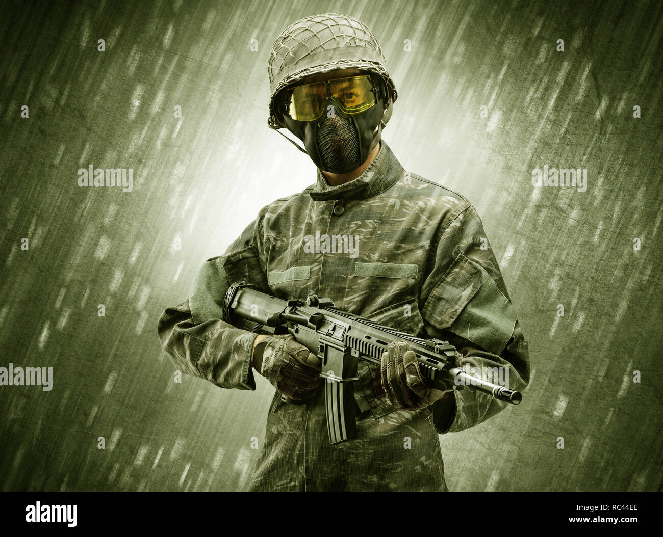 Armed soldier standing in rainy weather Stock Photo - Alamy