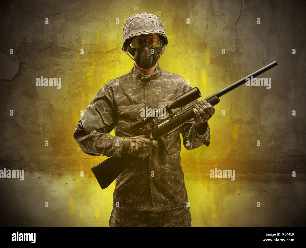 Hazard, menace soldier in a ruined crumbly building with arms on his ...