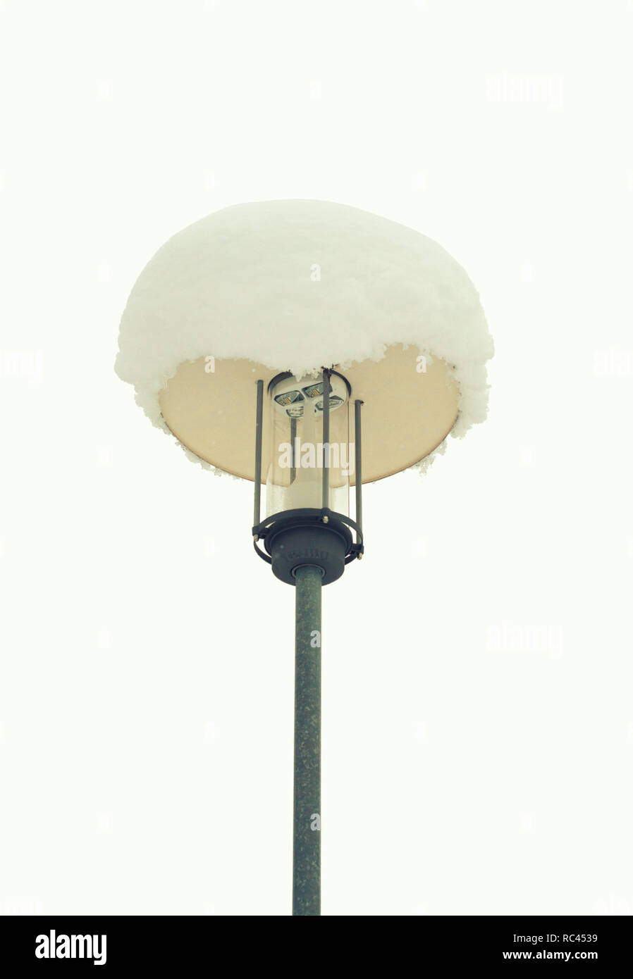 Led street lamp covered with snow isolated on white background. Snowy ...