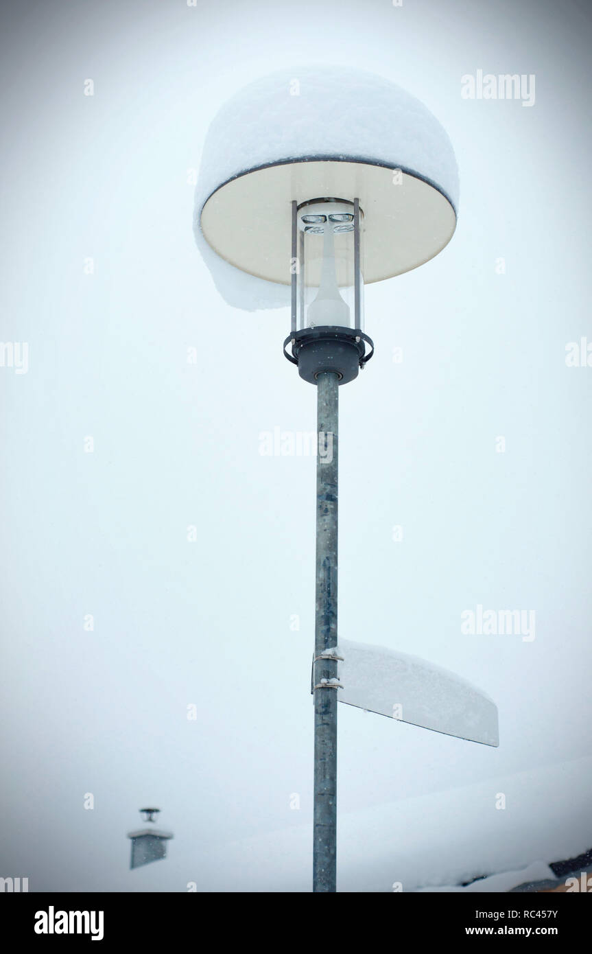 Led street lamp covered with snow. Snowy weather condition. Winter ...