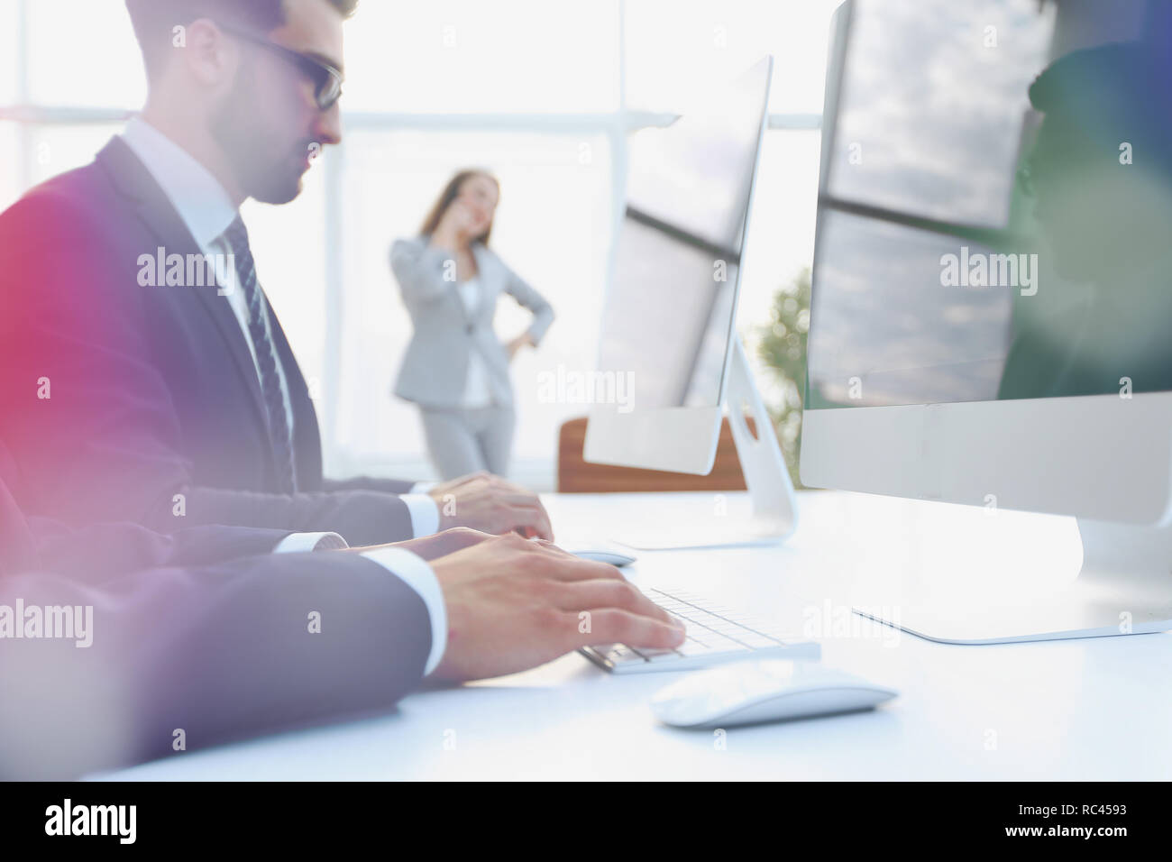 employees working on computers Stock Photo - Alamy
