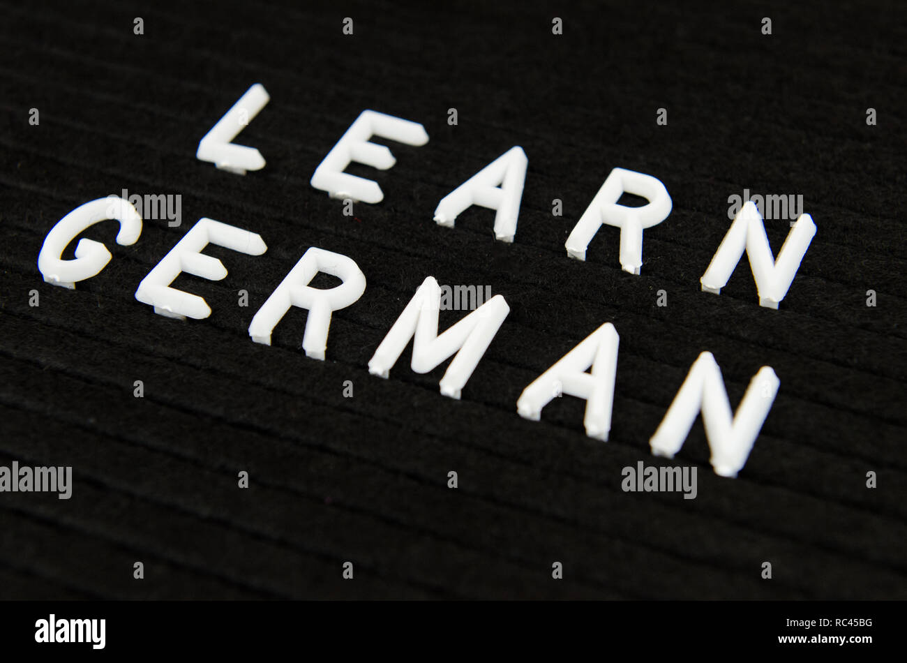 learn language sign on black background Stock Photo - Alamy