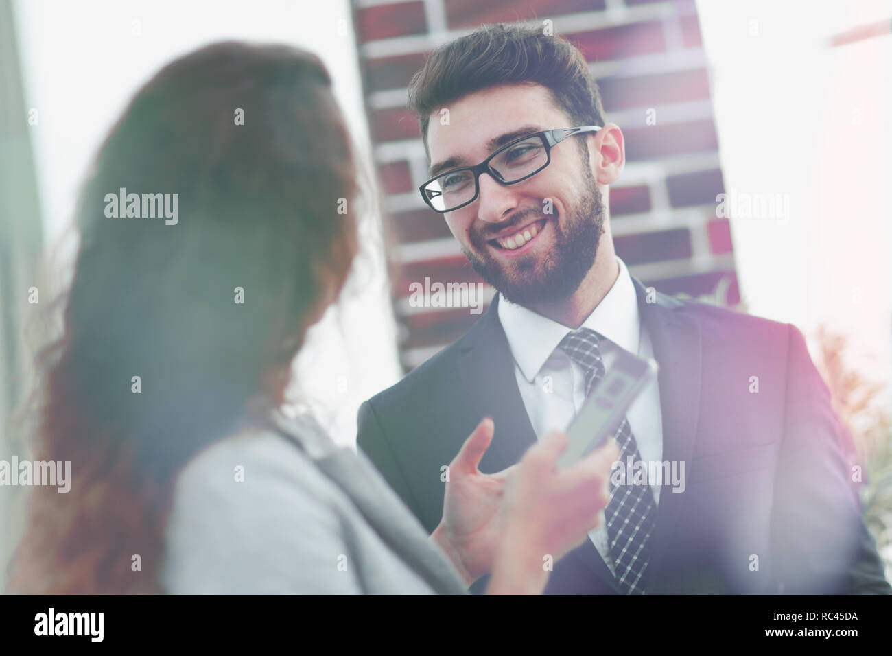 business partners communicating before the start of the official ...