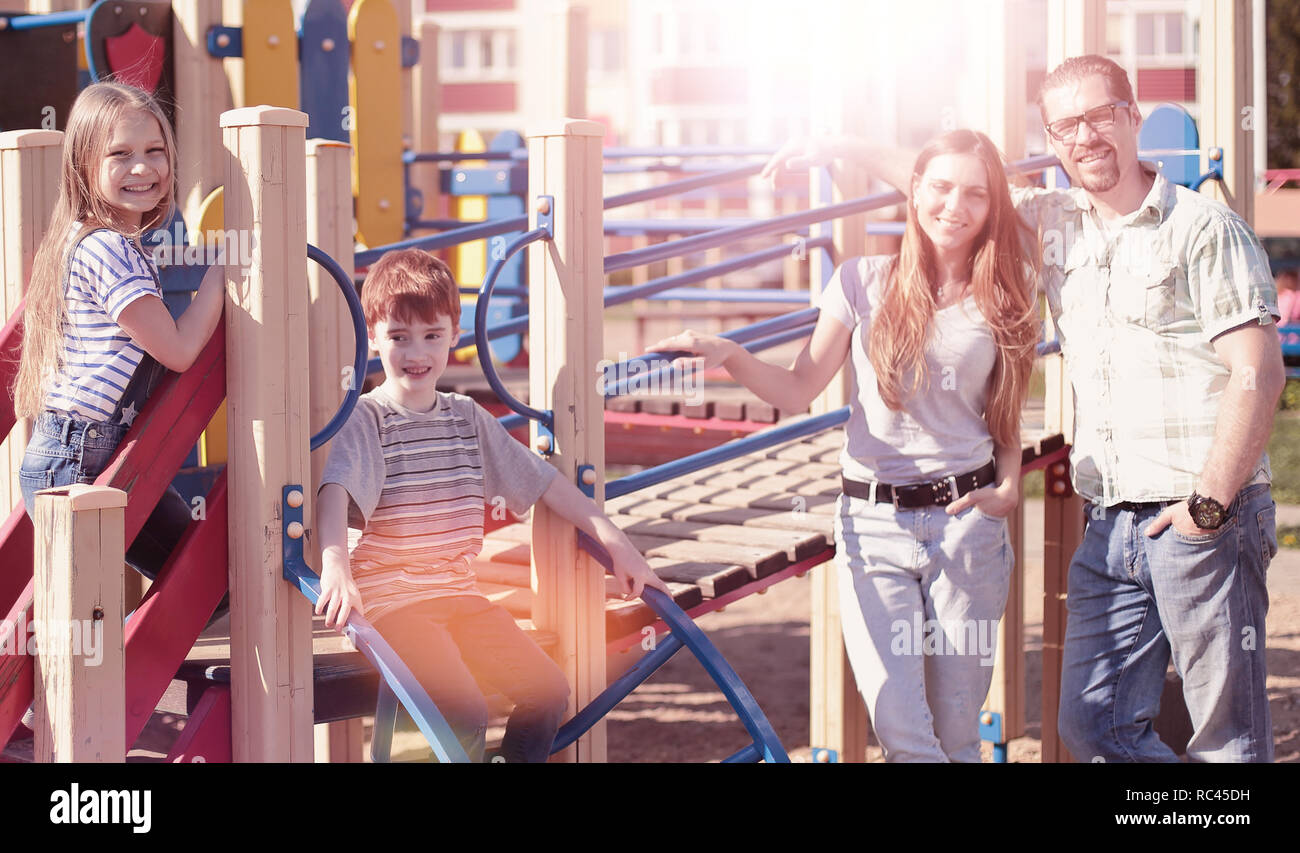 young family with children having fun on the Playground Stock Photo - Alamy