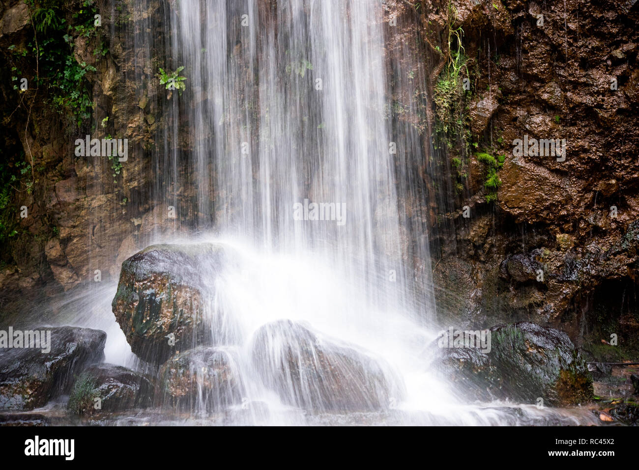 Waterfall flowing from mountain Stock Photo - Alamy