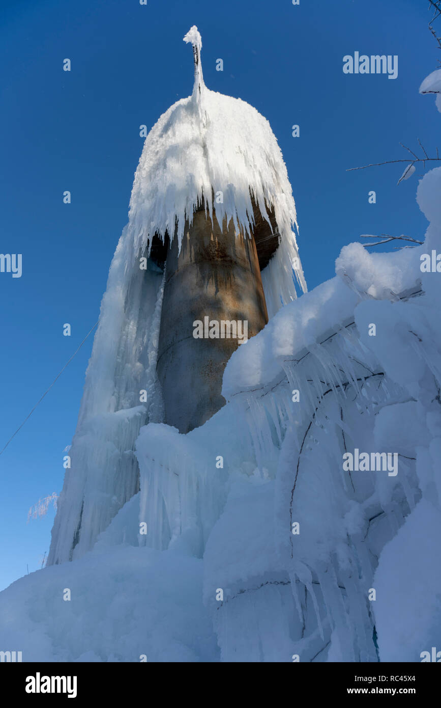 Frozen water tower, hanging huge frozen streams of water Stock Photo ...