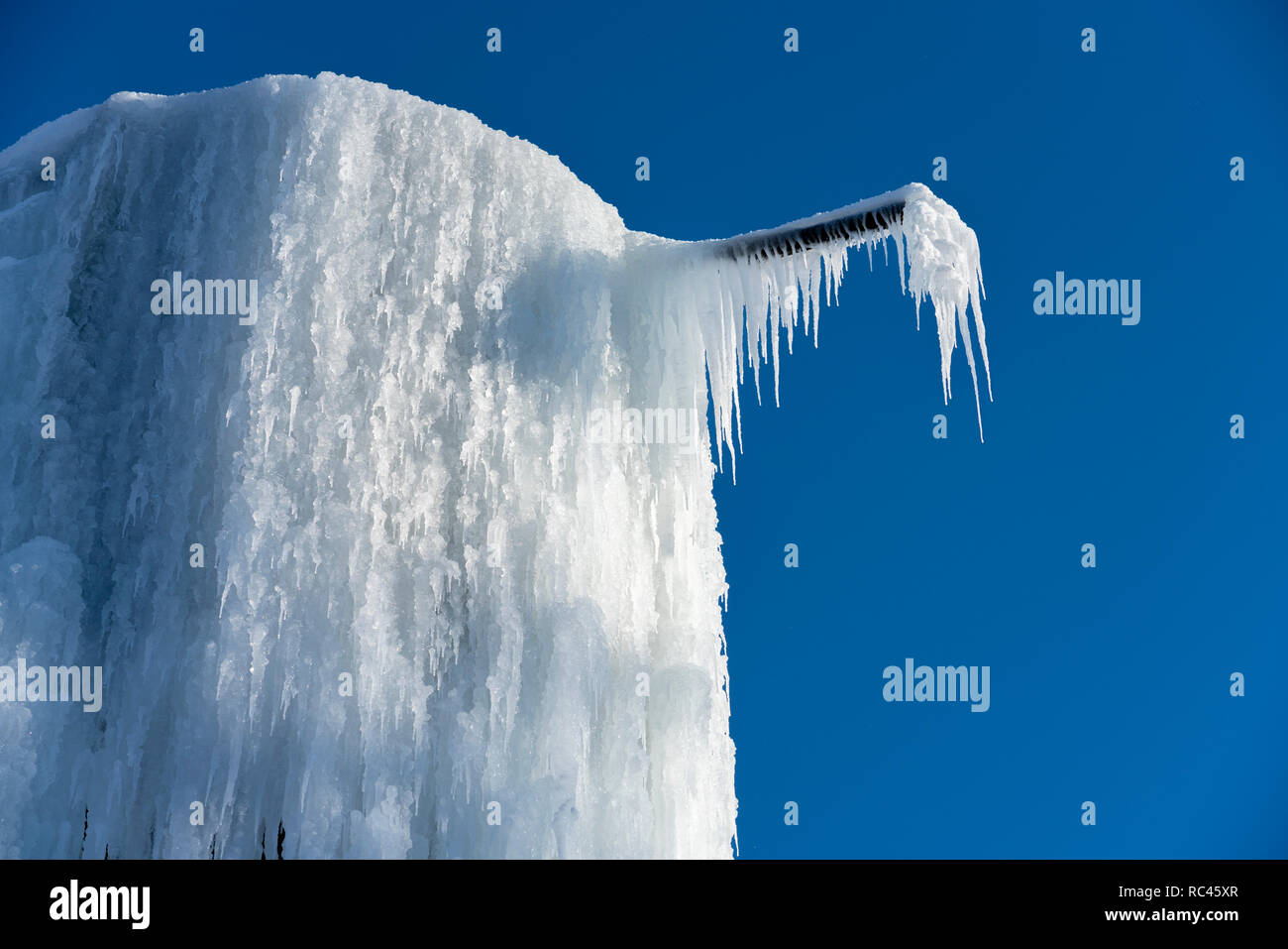 Frozen water tower, hanging huge frozen streams of water Stock Photo ...