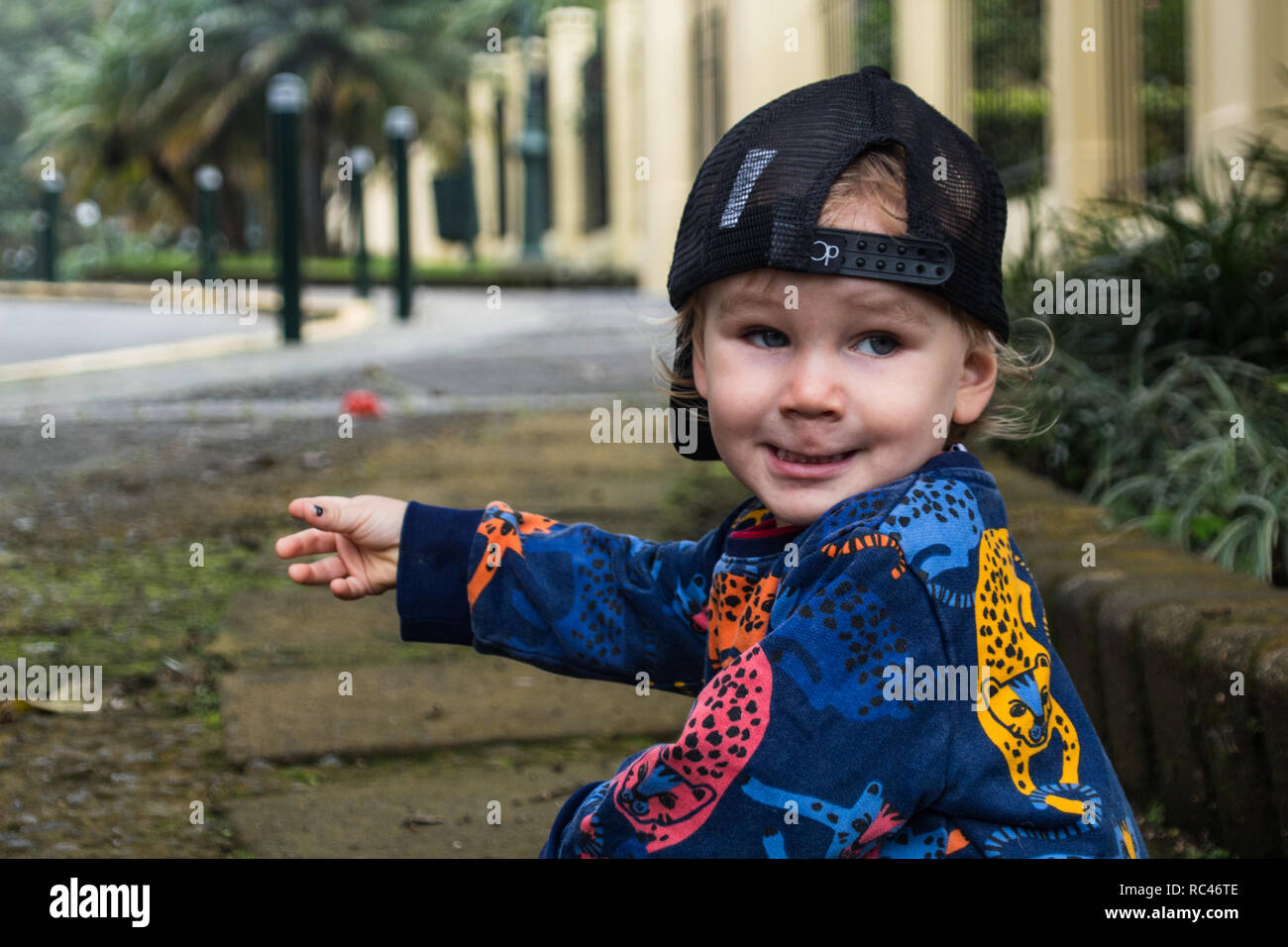 Boy playing outside trees hi-res stock photography and images - Alamy