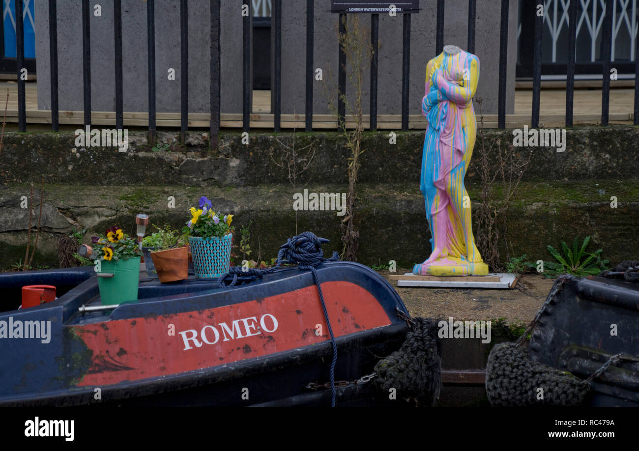 Boat and statue in the canal by Broadway market in Hackney, London ...