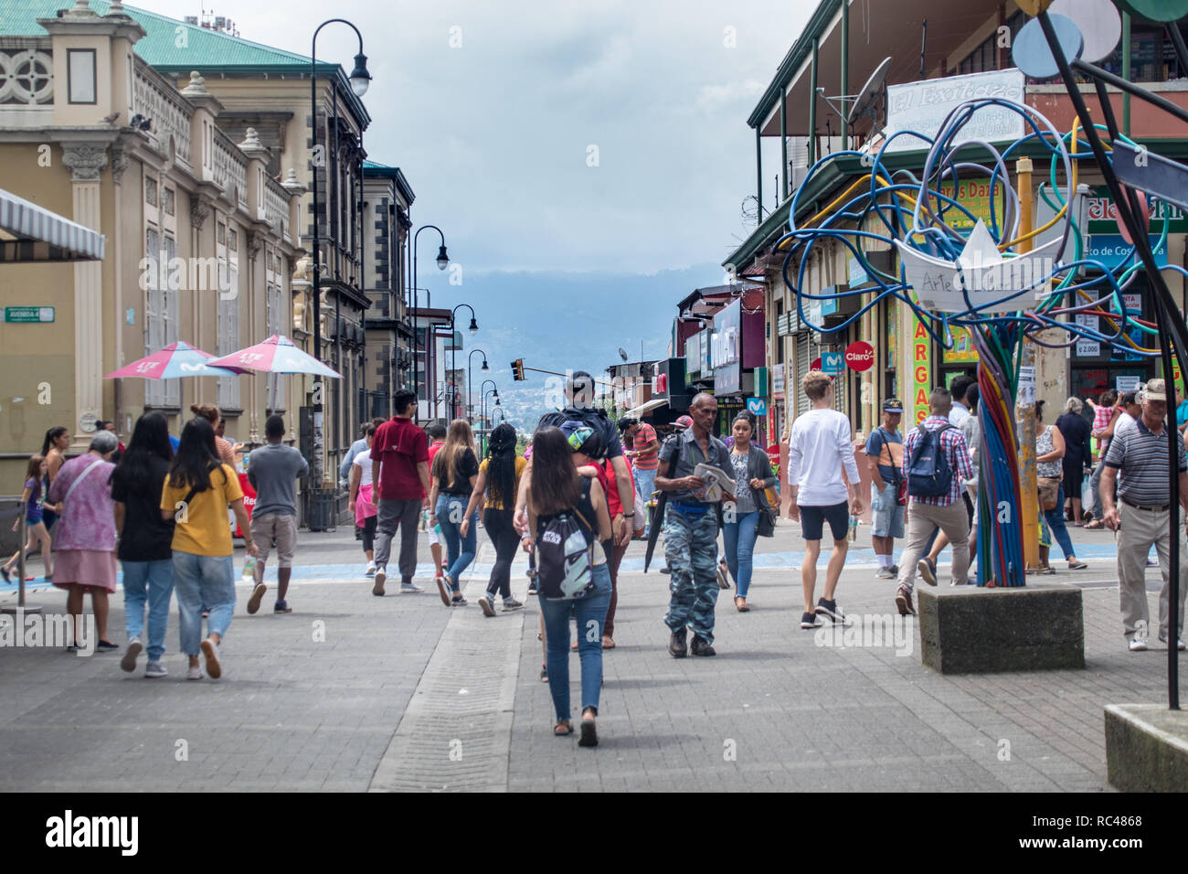 A photo of pedestrians walking on a busy street in the old town of San ...