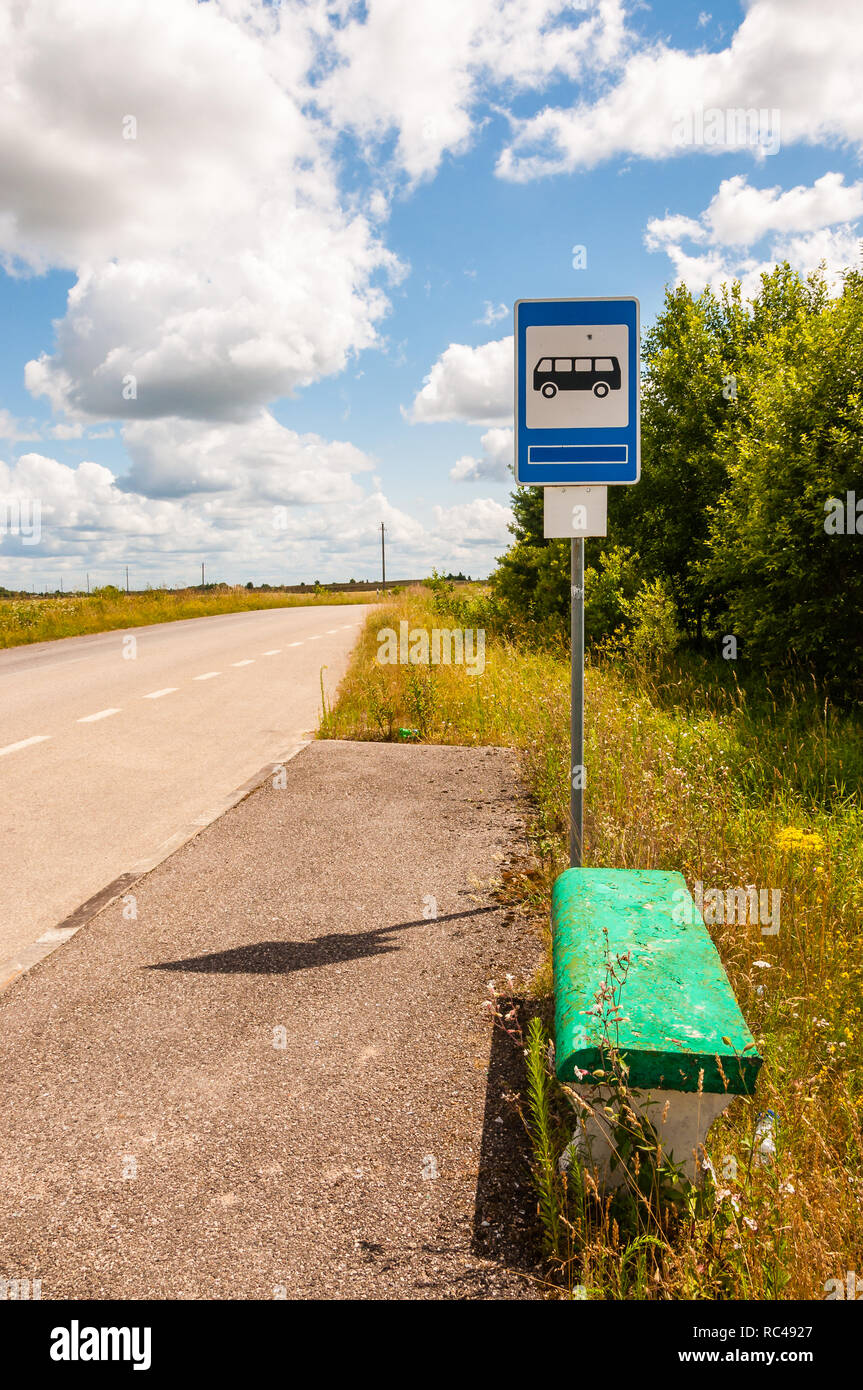 Old fashion bus stop with painted green concrete bench on country road ...