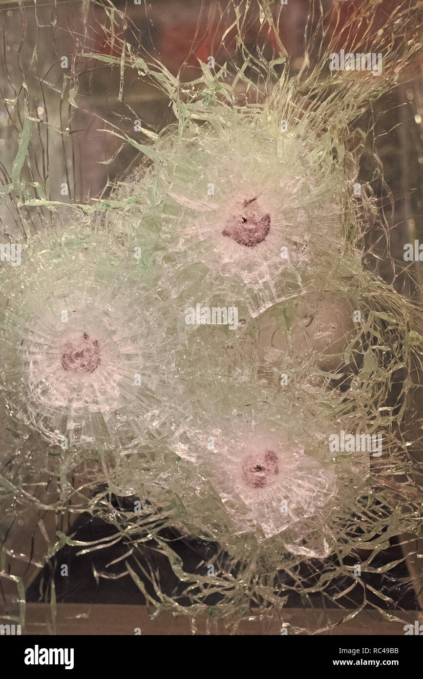 Bulletproof glass after gunshot, close up. Bulletproof glass destroyed ...