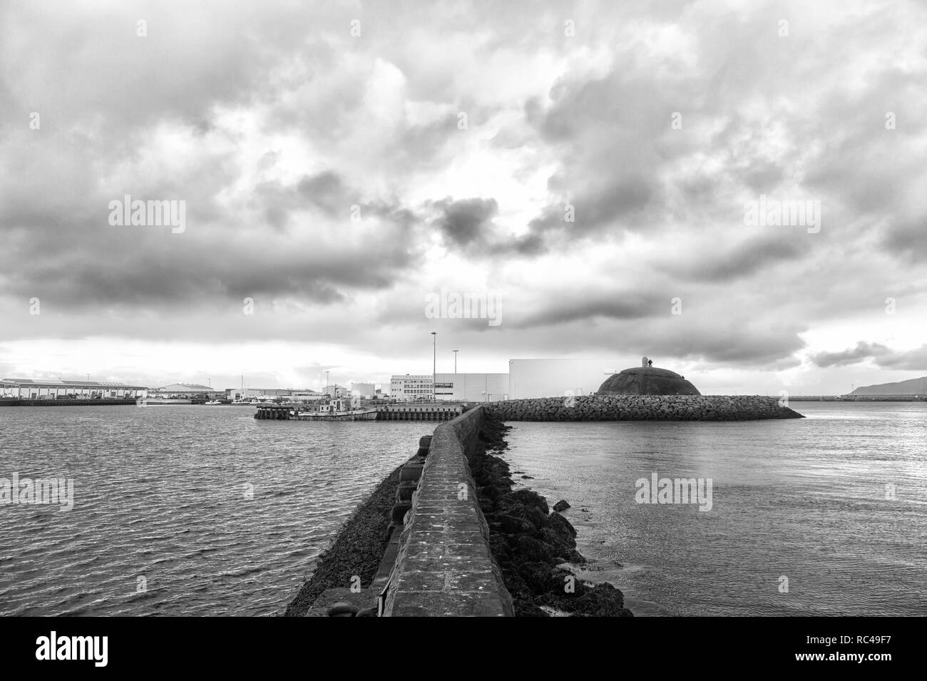 Stony breakwater in sea. Breakwater surround docks, ports and lagoons ...