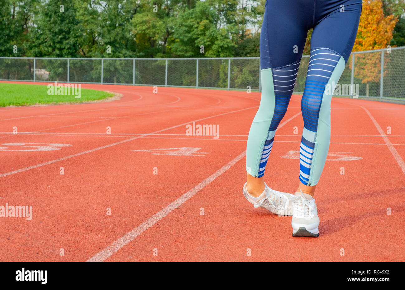 Woman legs stumbling on the run track during running Stock Photo - Alamy