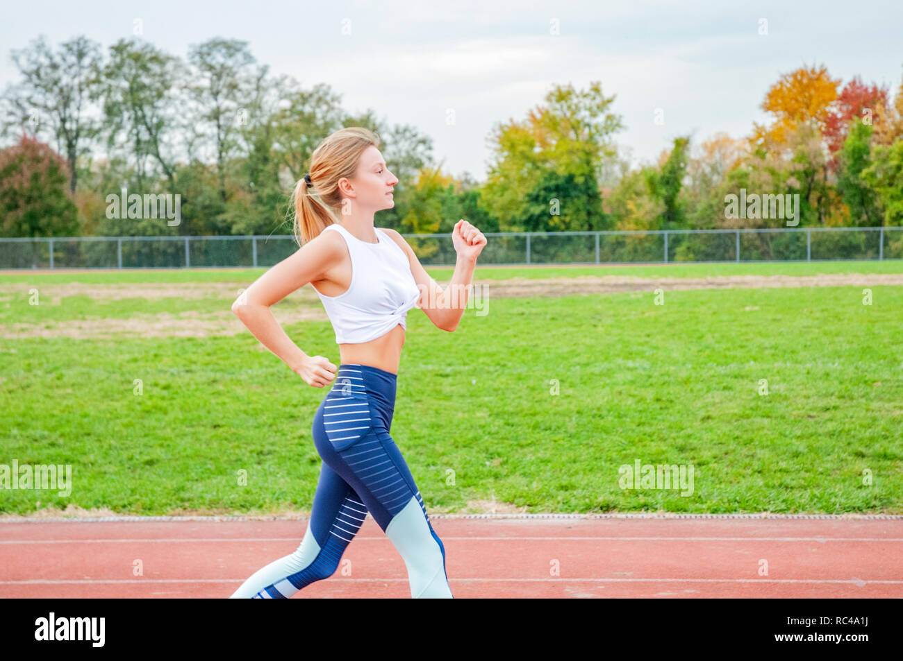 Healthy lifestyle young fitness woman running. Female runner practicing ...