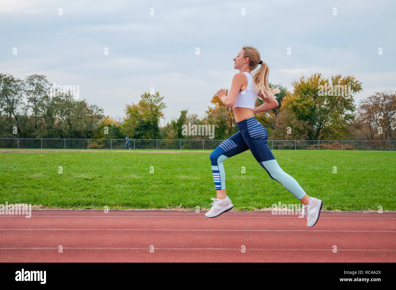 Healthy lifestyle young fitness woman running. Female runner practicing ...