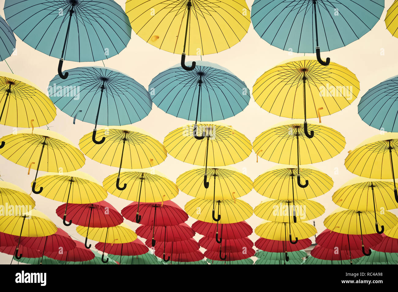 Umbrella sky project installation. Umbrellas float in sky on sunny day ...