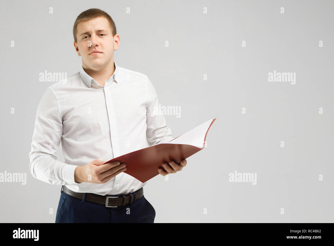 Young boss holding a folder hi-res stock photography and images - Alamy