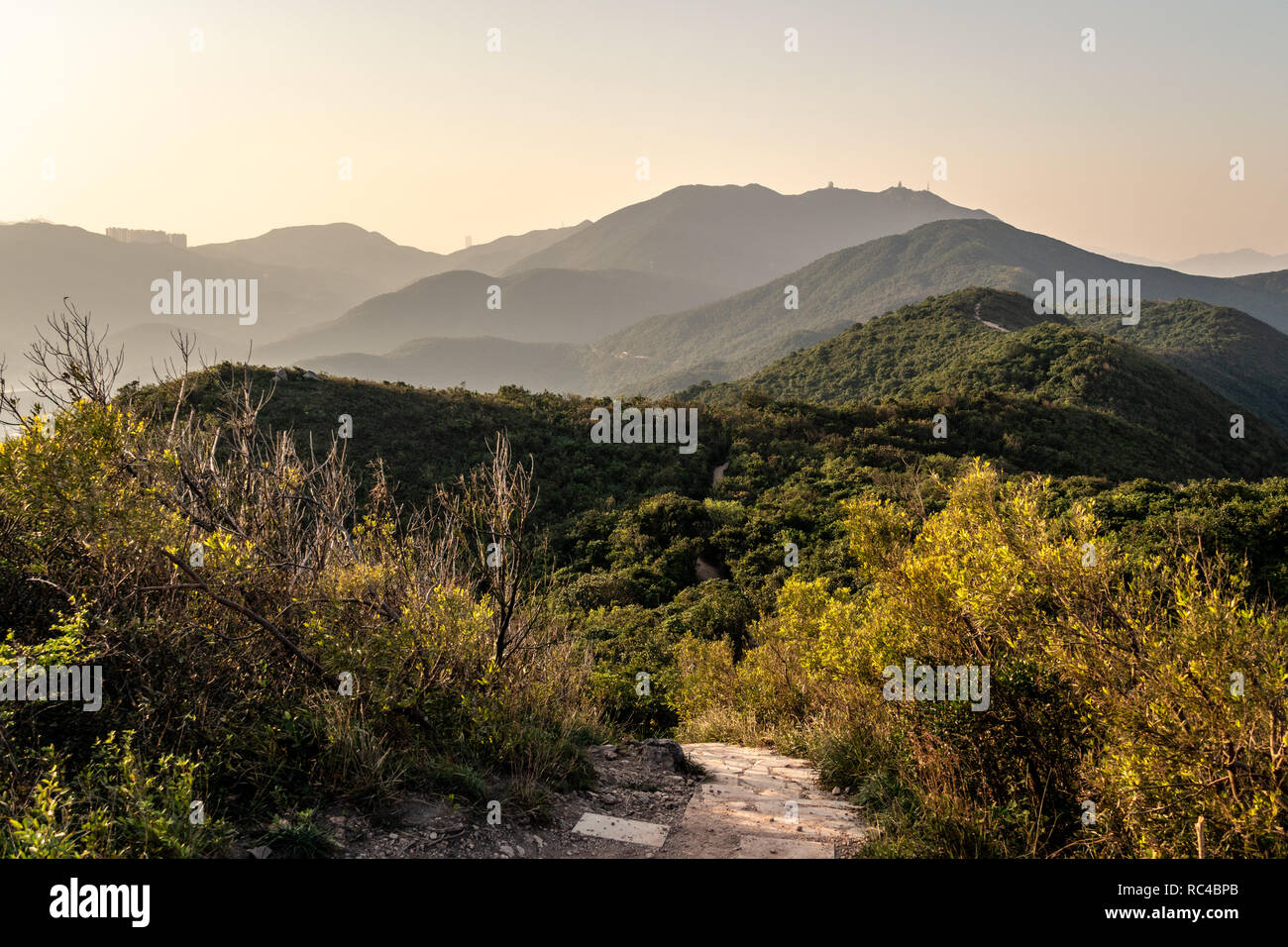 Sunset over Dragon's back hiking trail in Hong Kong island. This is a ...