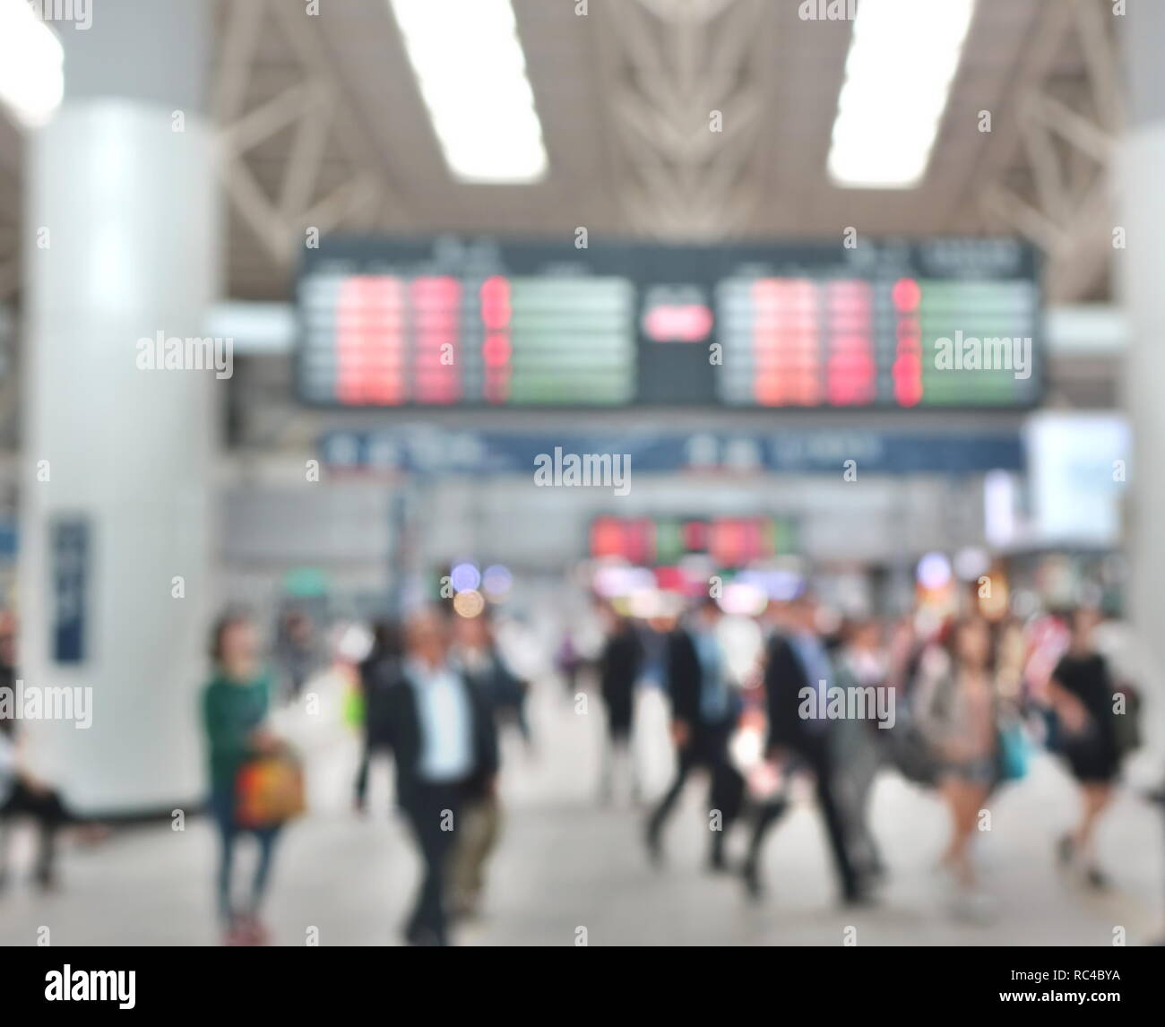 A blurred background of a busy transportation terminal such as a bus or ...