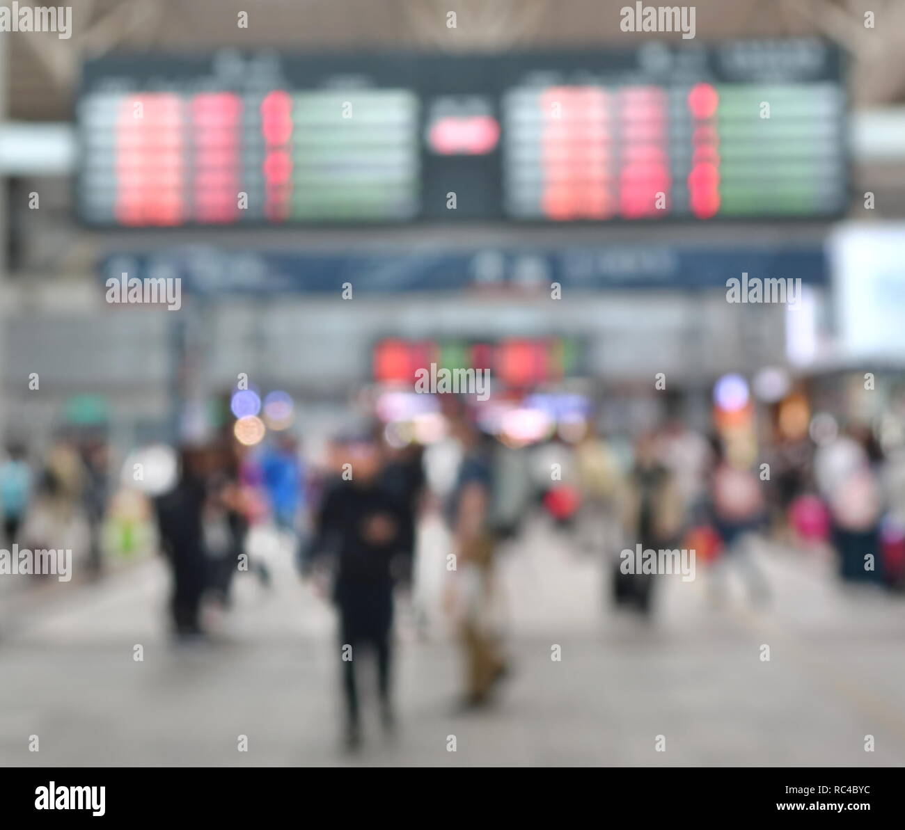 A blurred background of a busy transportation terminal such as a bus or ...