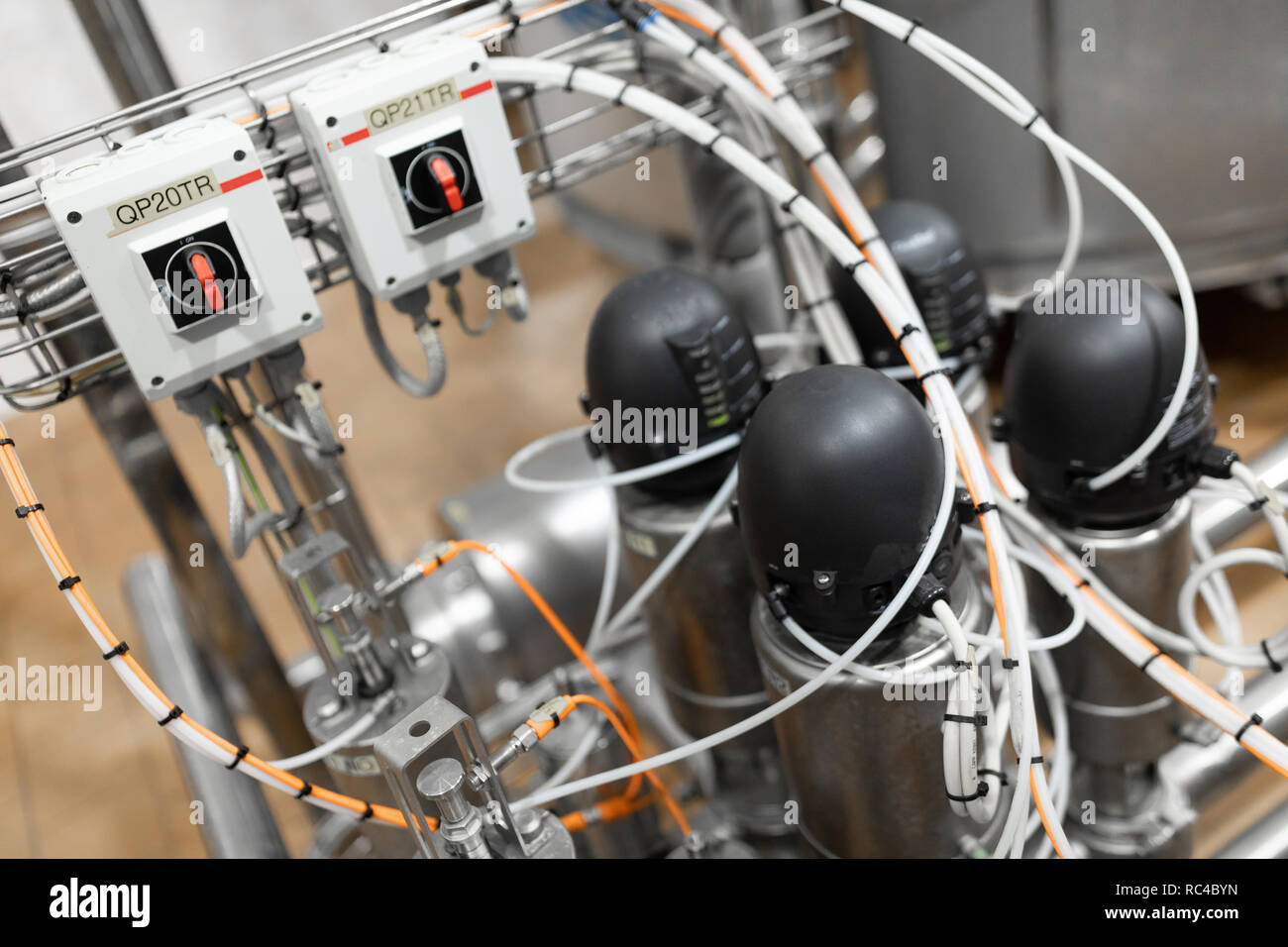 Cheese-making equipment of cheese factory background Stock Photo - Alamy