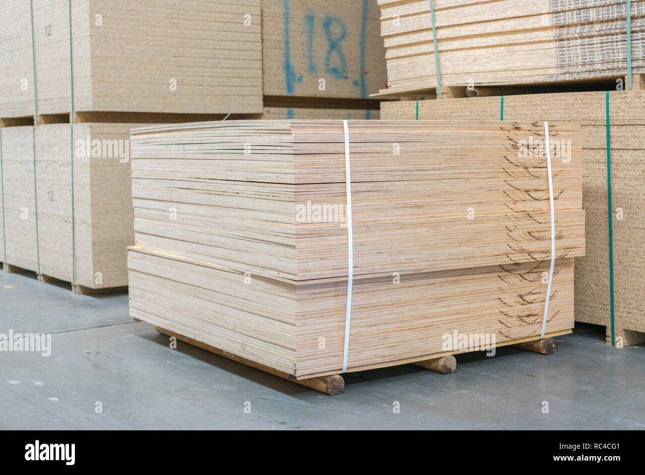 timber in warehouse. Pallet with boards in the hardware store. Packed ...