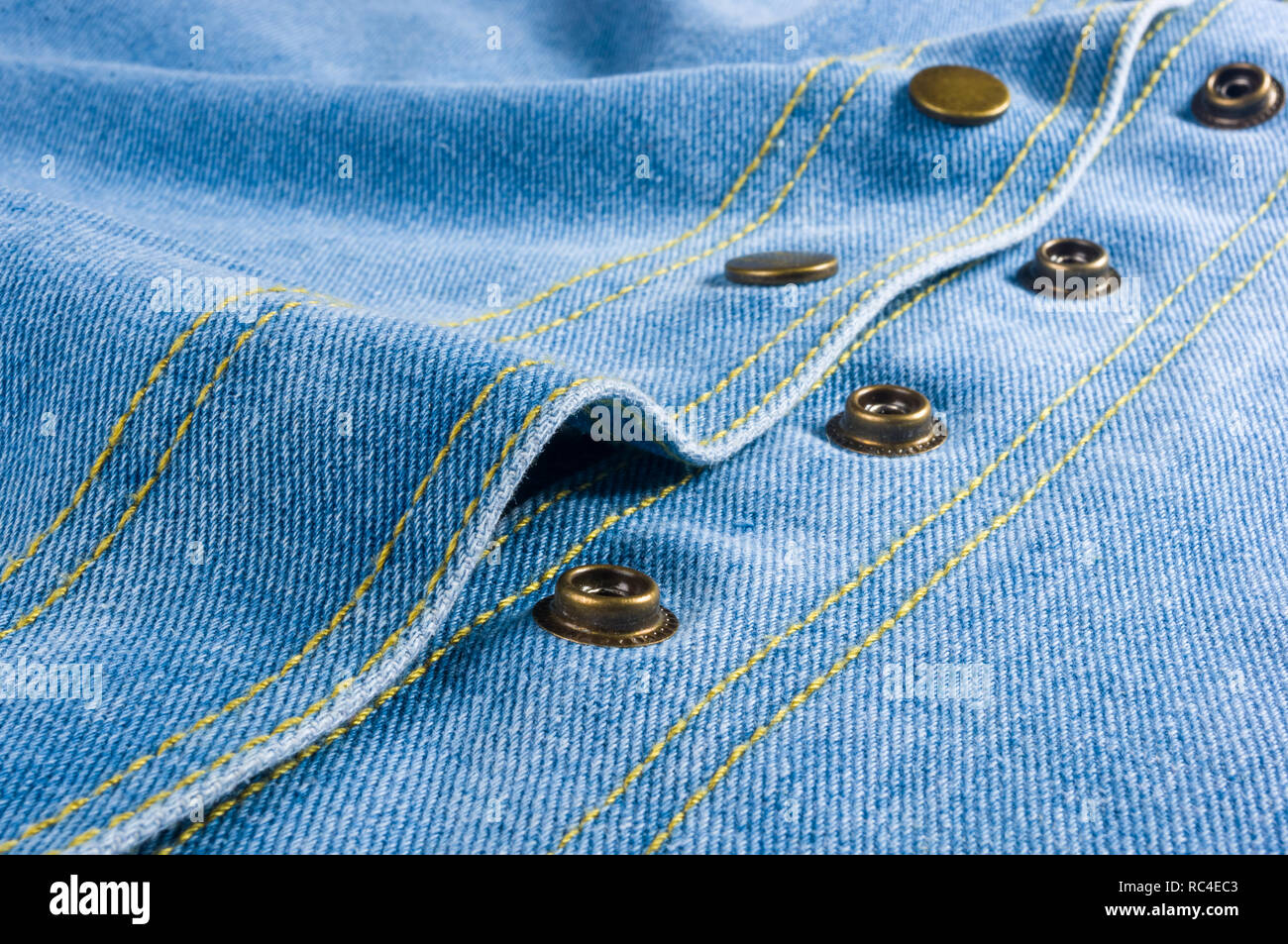 Blue washed faded jeans texture with seams, clasps, buttons and rivets ...