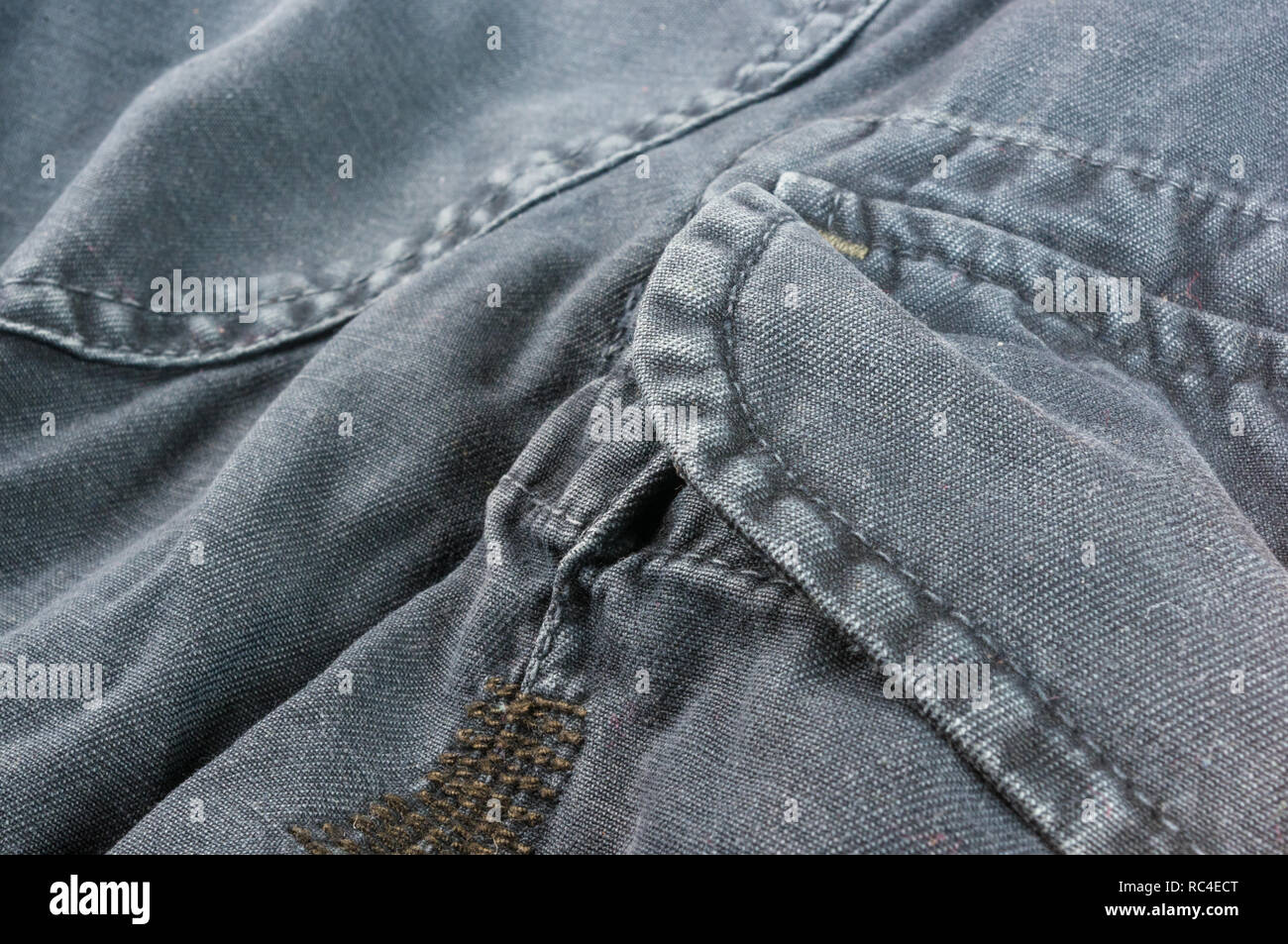 clothing items washed cotton fabric texture with seams, macro, close-up ...
