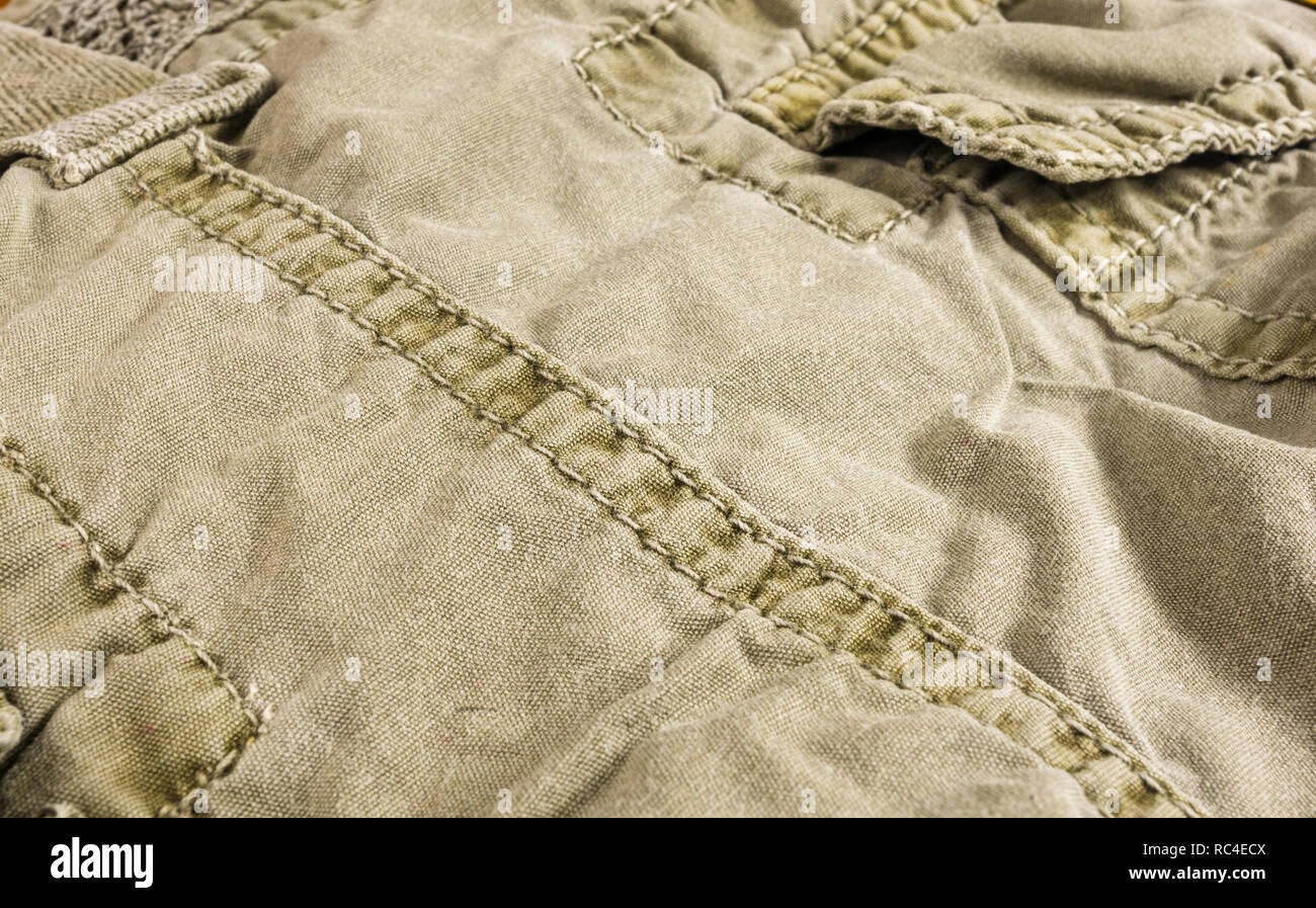 clothing items washed cotton fabric texture with seams, macro, close-up ...