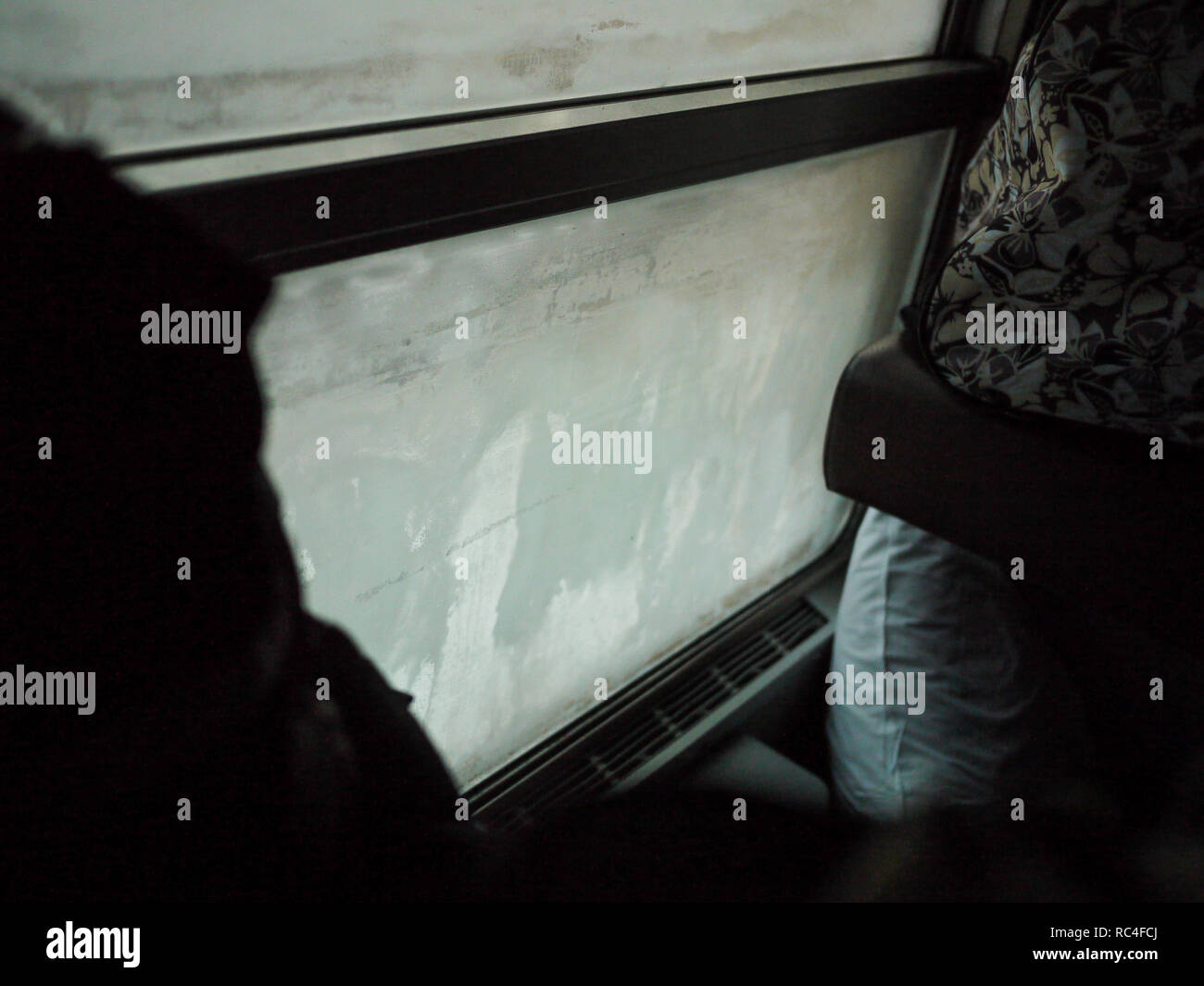 Railway station quay, seen through a fogged train window, Domodossola ...
