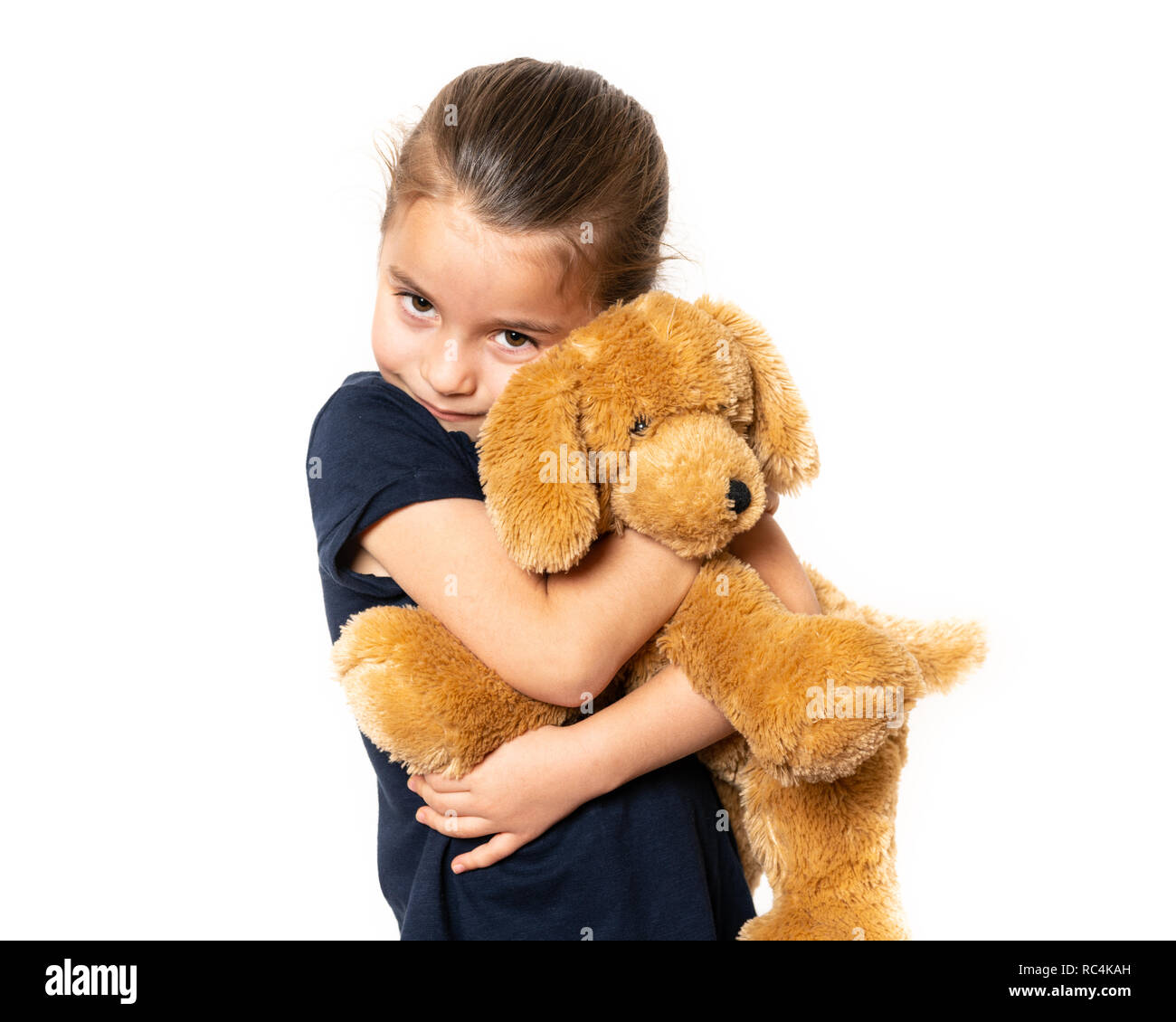 Happy preschool girl cuddling her favorite teddy bear Stock Photo - Alamy