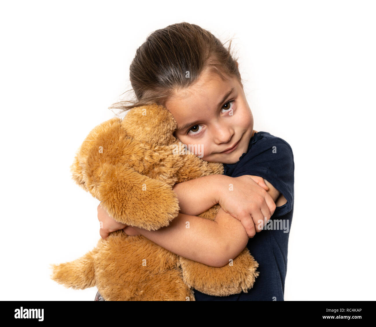 Happy preschool girl cuddling her favorite teddy bear Stock Photo - Alamy