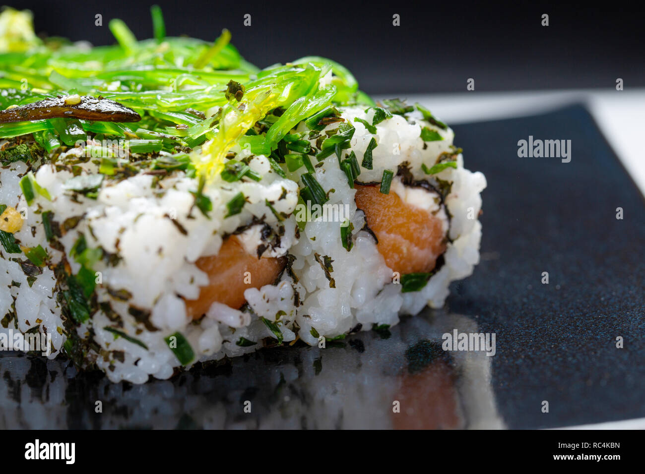 Black plate with american rolls photographed closely Stock Photo - Alamy
