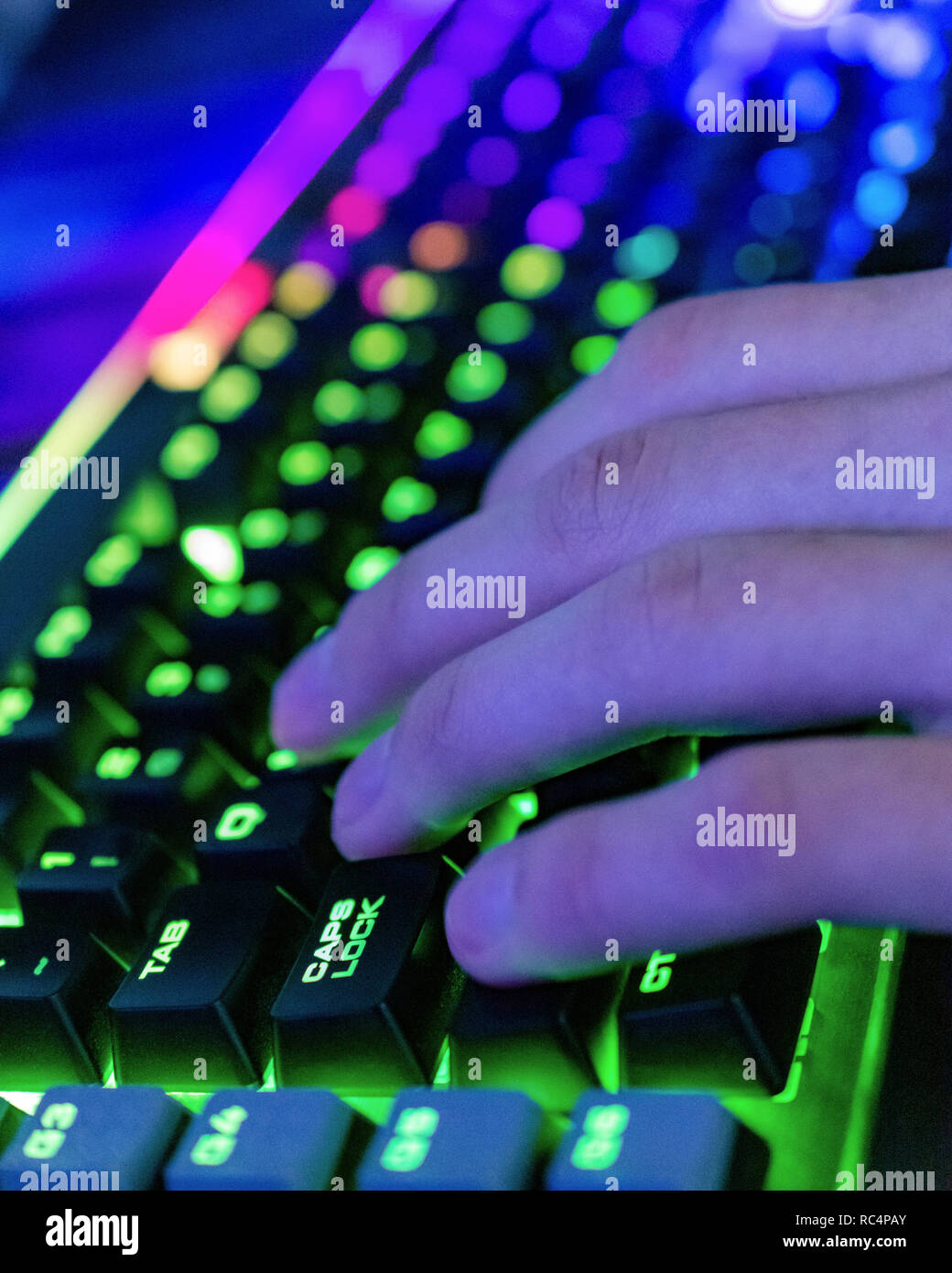 Close up view of gamer's hand on colorful gaming keyboard Stock Photo ...